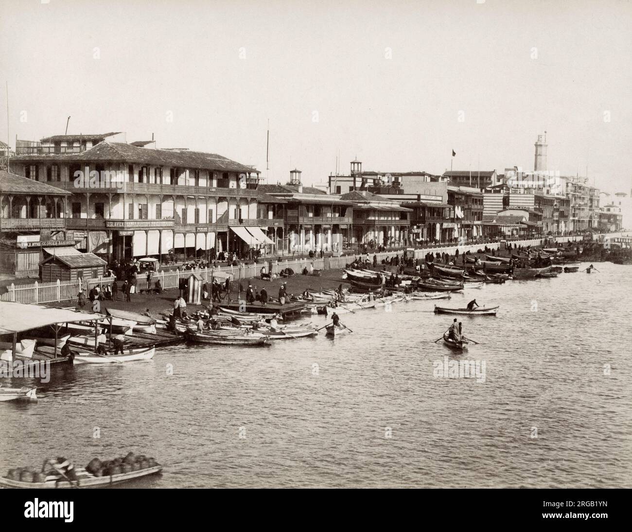 19th century vintage photograph: boats pulled up along the shore, Port ...