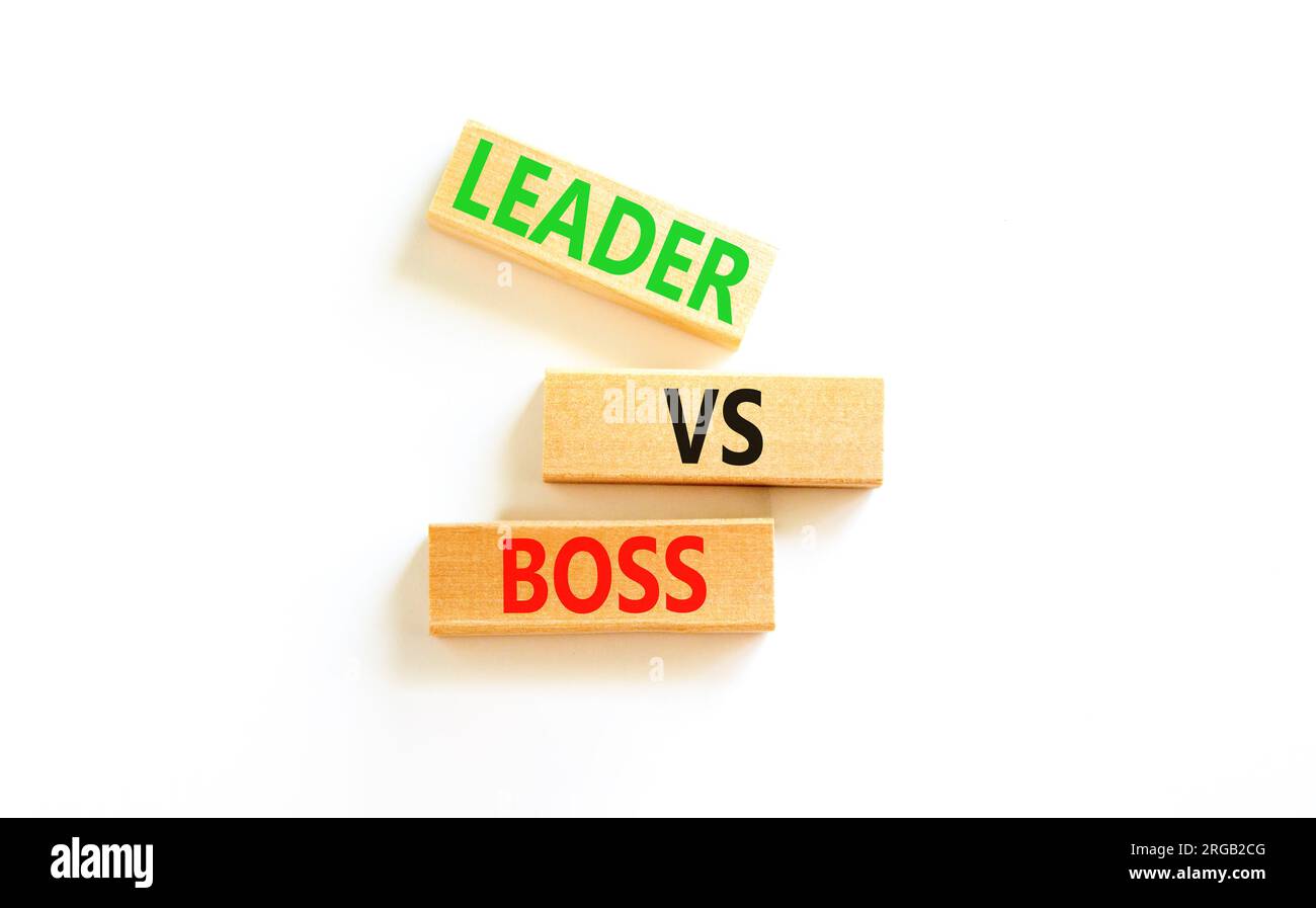 Boss vs leader symbol. Concept words Boss vs versus leader on wooden ...
