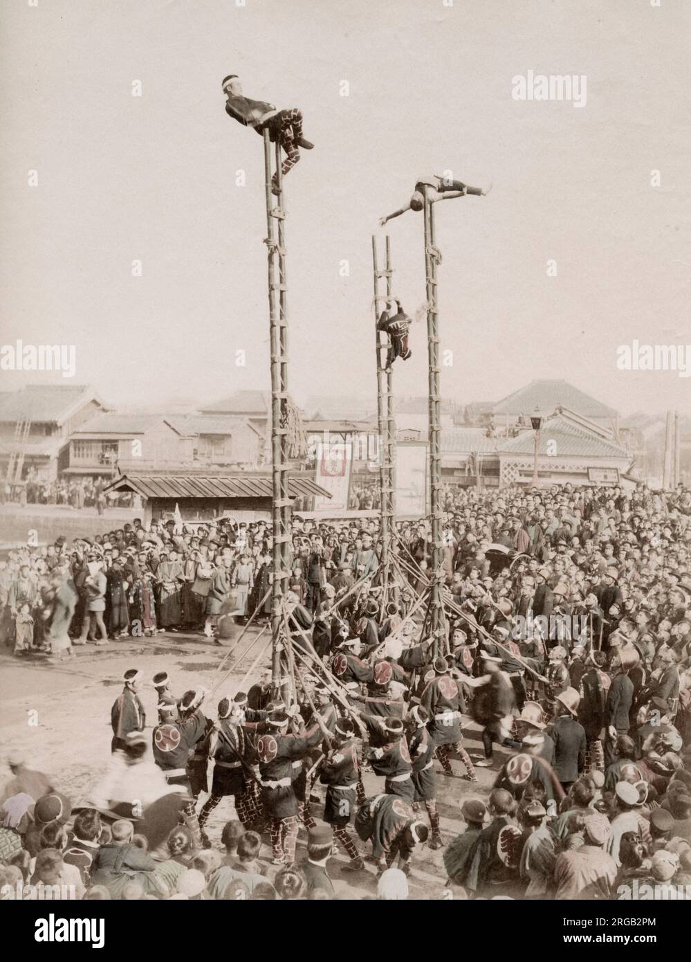 19th century vintage photograph: acrobatic display by Japanese firemen ...
