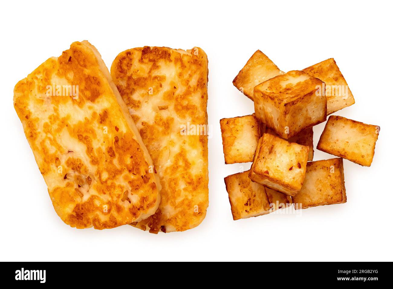 Two fried slices and cubes of halloumi cheese with red chilli isolated ...