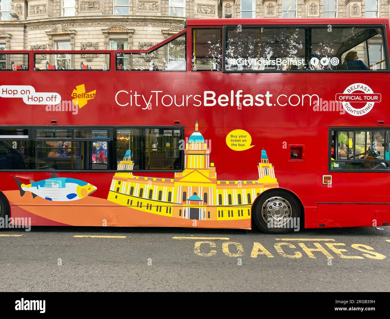 Tour bus in Belfast city in central Belfast Stock Photo - Alamy