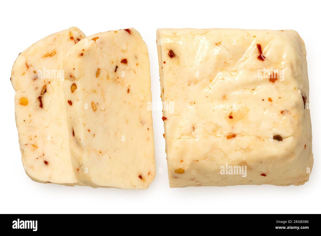 Sliced block of halloumi cheese with red chilli isolated on white. Top ...