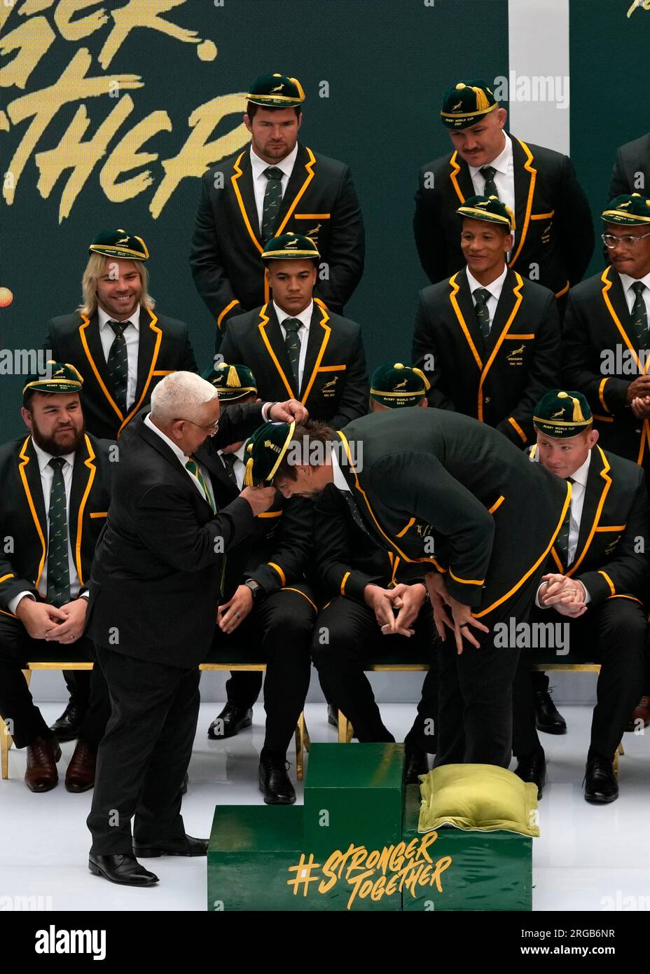 South Africa's Eben Etzebeth, right, bows down as is caped Mark ...