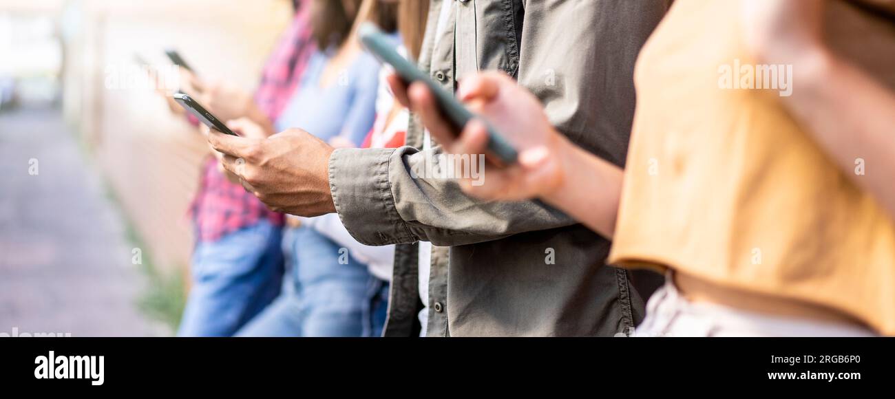 Horizontal banner with bored friends group using smartphone sitting at ...