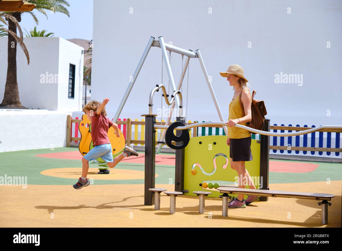 Mother and son playing on playground Stock Photo - Alamy
