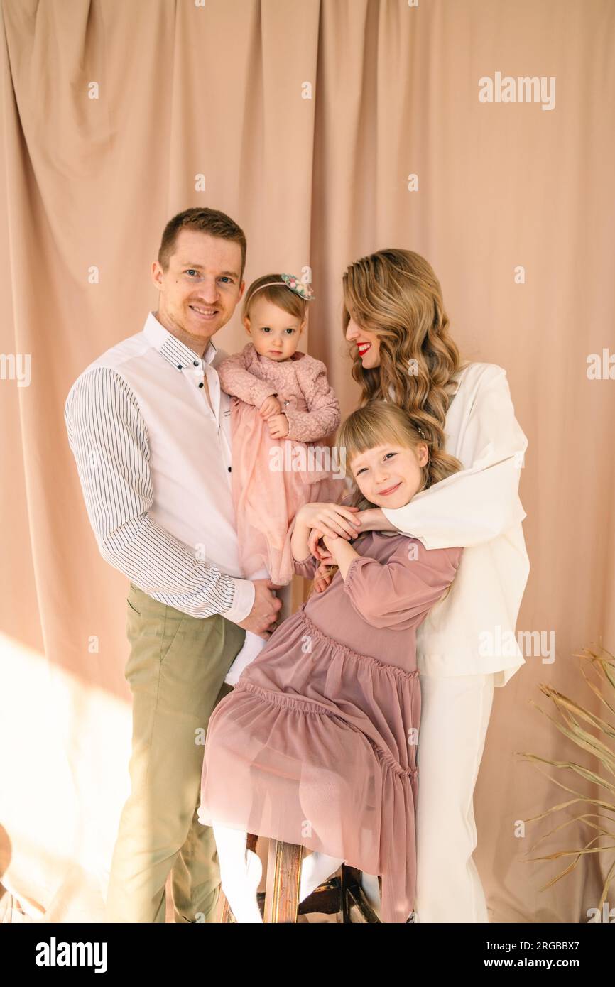 Mother father two daughters studio hi-res stock photography and images ...