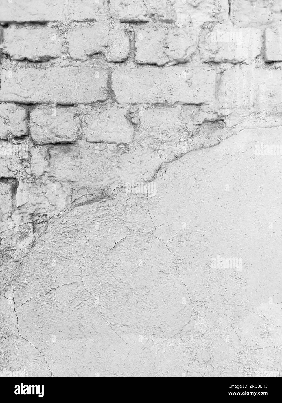 Surface of plastered brick wall of old building with cracks and ...