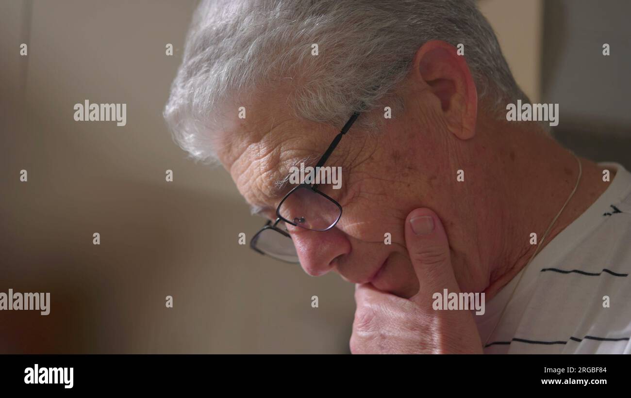 Pensive older caucasian senior pondering decision in deep mental ...