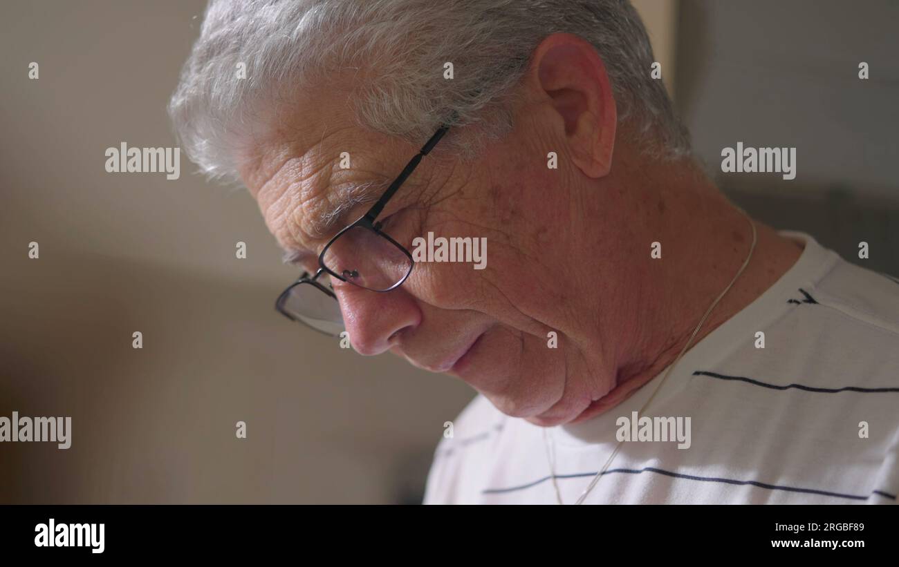 Pensive older caucasian senior pondering decision in deep mental ...