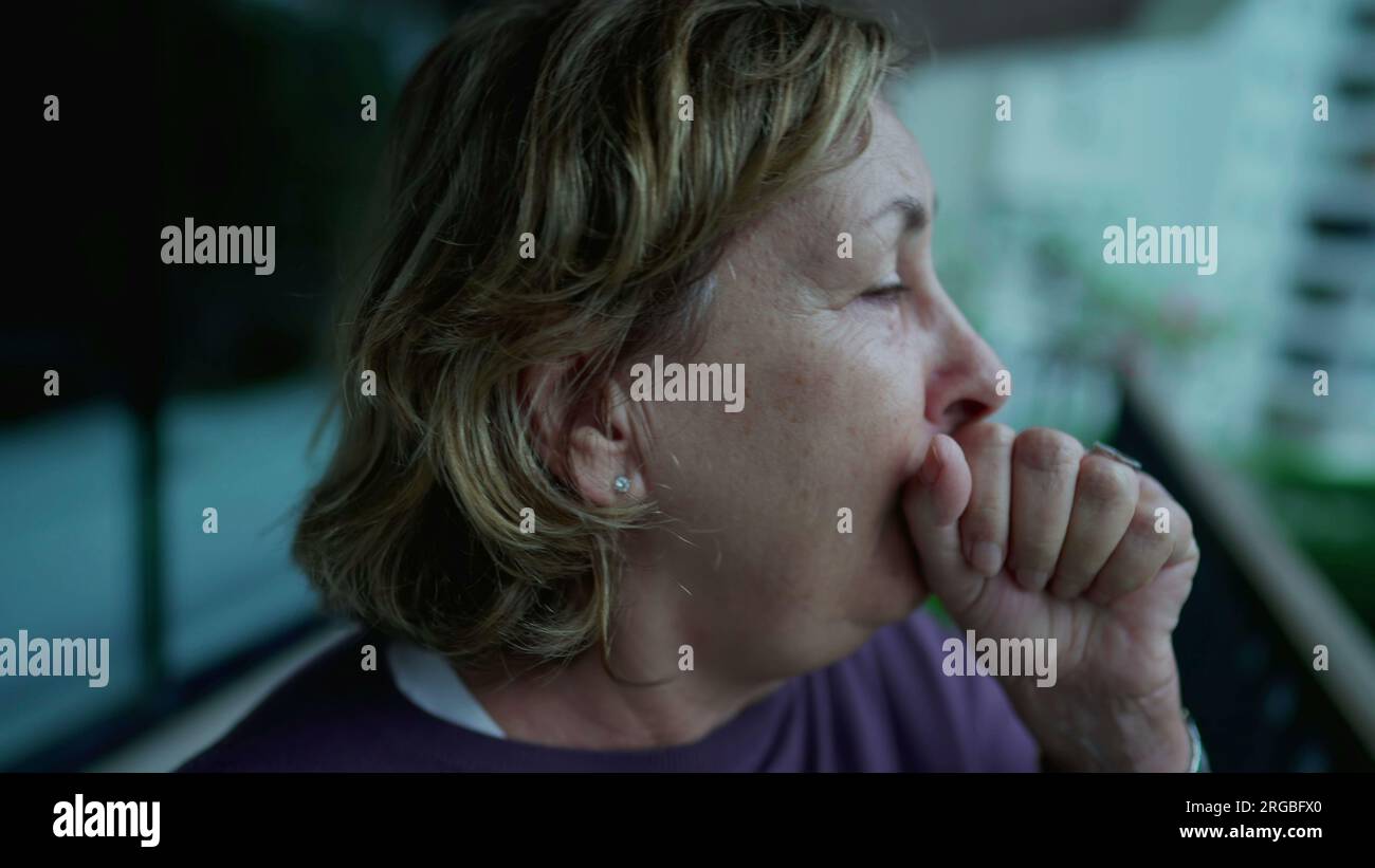 Senior woman coughing. Real life authentic older lady coughs covering ...