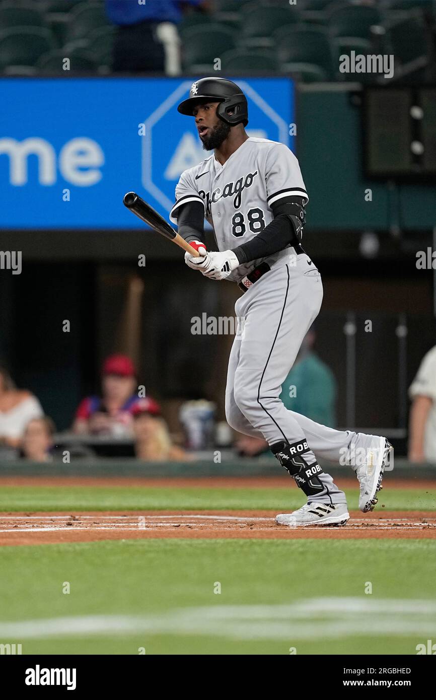 Chicago White Sox's Luis Robert Jr. follows through on a swing during a ...