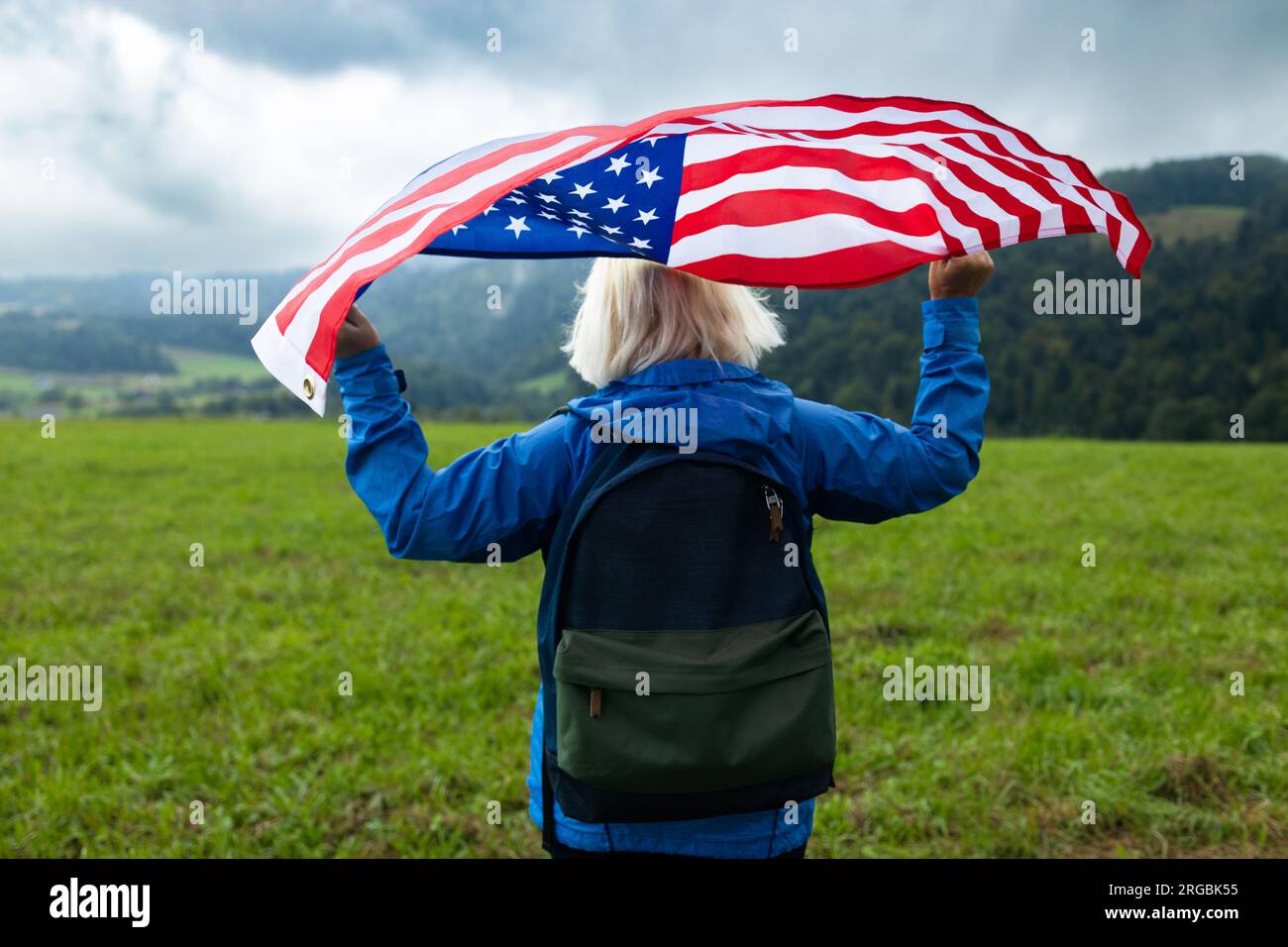Close up back view of senior caucasian 50s woman walking and holding ...