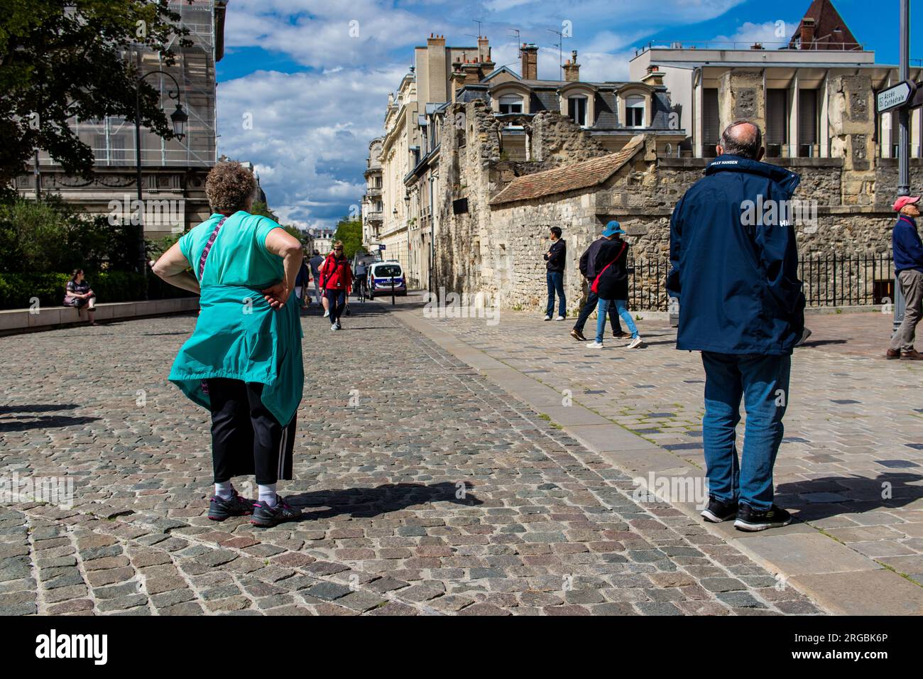 Reims, France - August 07, 2022 People wandering in the street of Reims ...