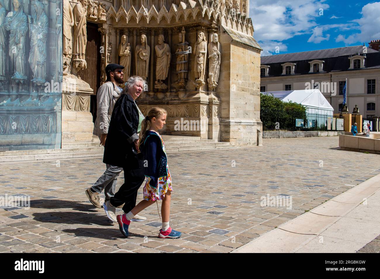 Reims, France - August 07, 2022 People wandering in the street of Reims ...