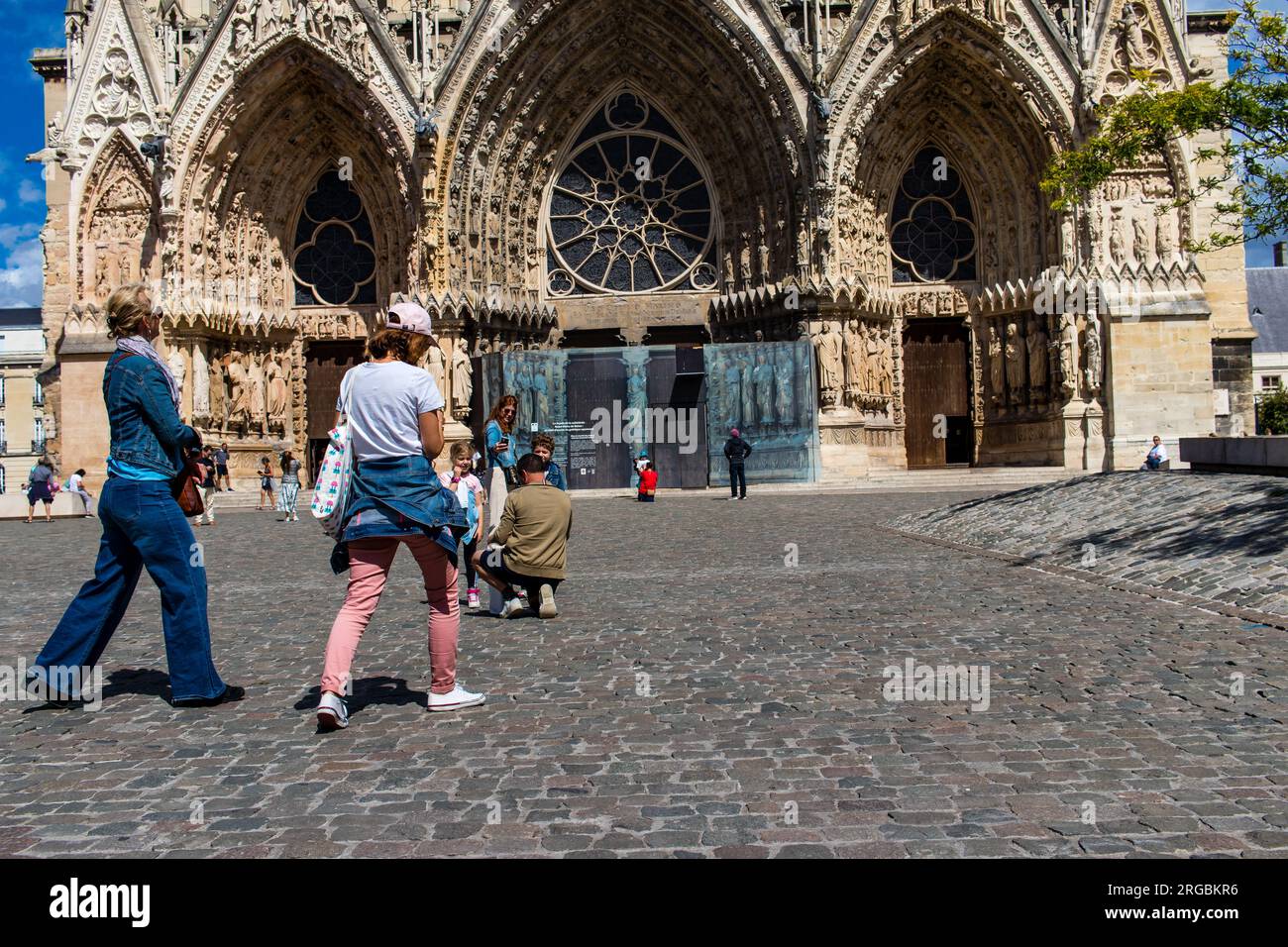 Reims, France - August 07, 2022 People wandering in the street of Reims ...