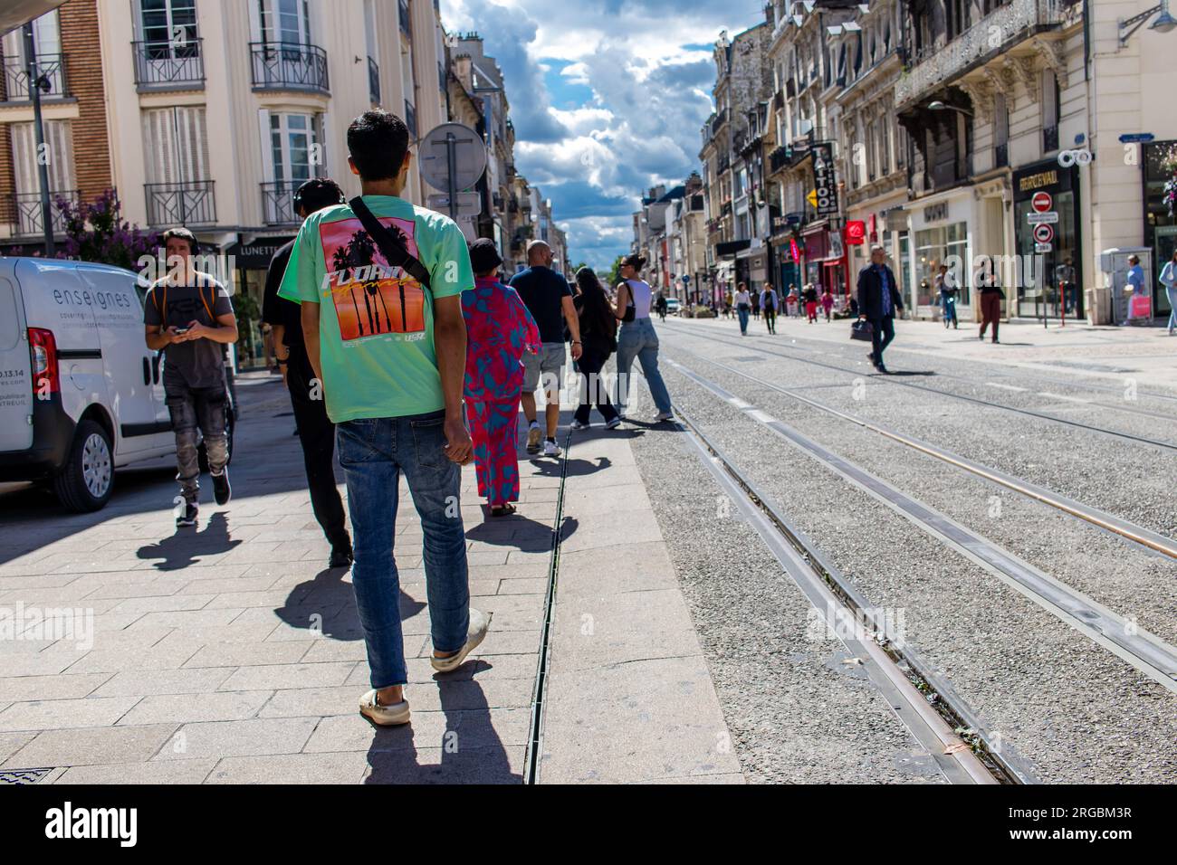 Reims, France - August 07, 2022 People wandering in the street of Reims ...