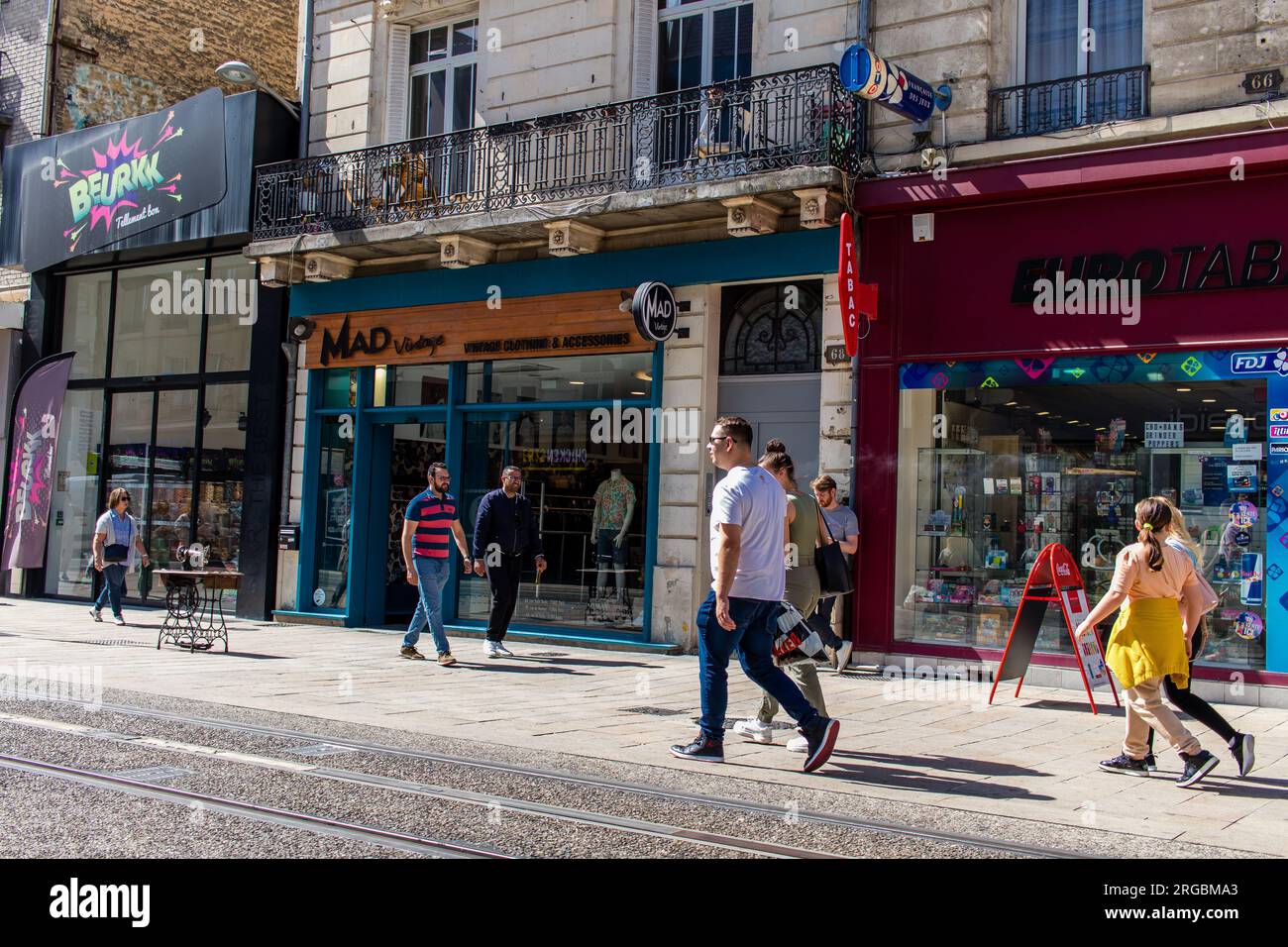 Reims, France - August 07, 2022 People wandering in the street of Reims ...