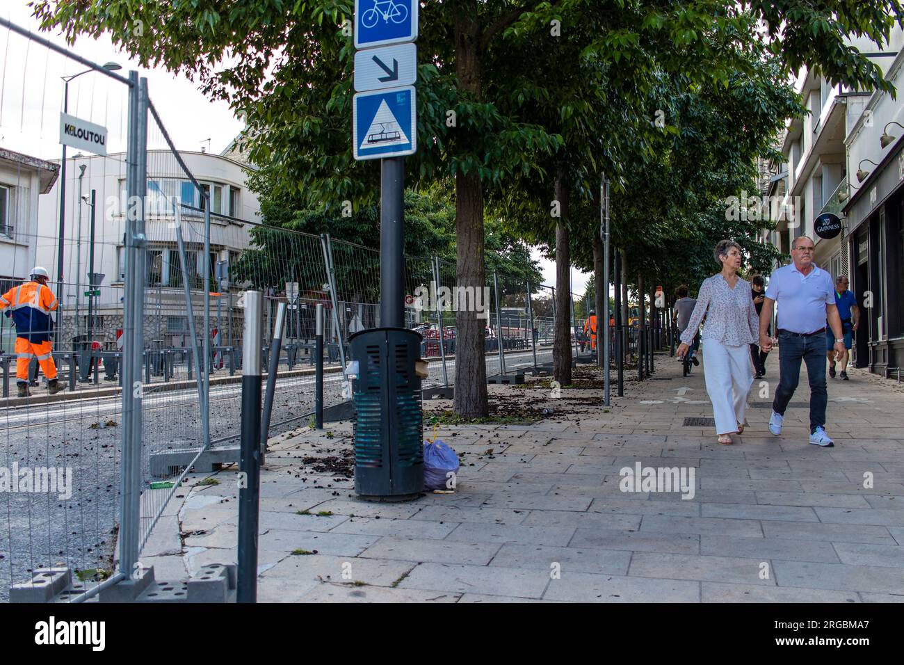 Reims, France - August 07, 2022 People wandering in the street of Reims ...