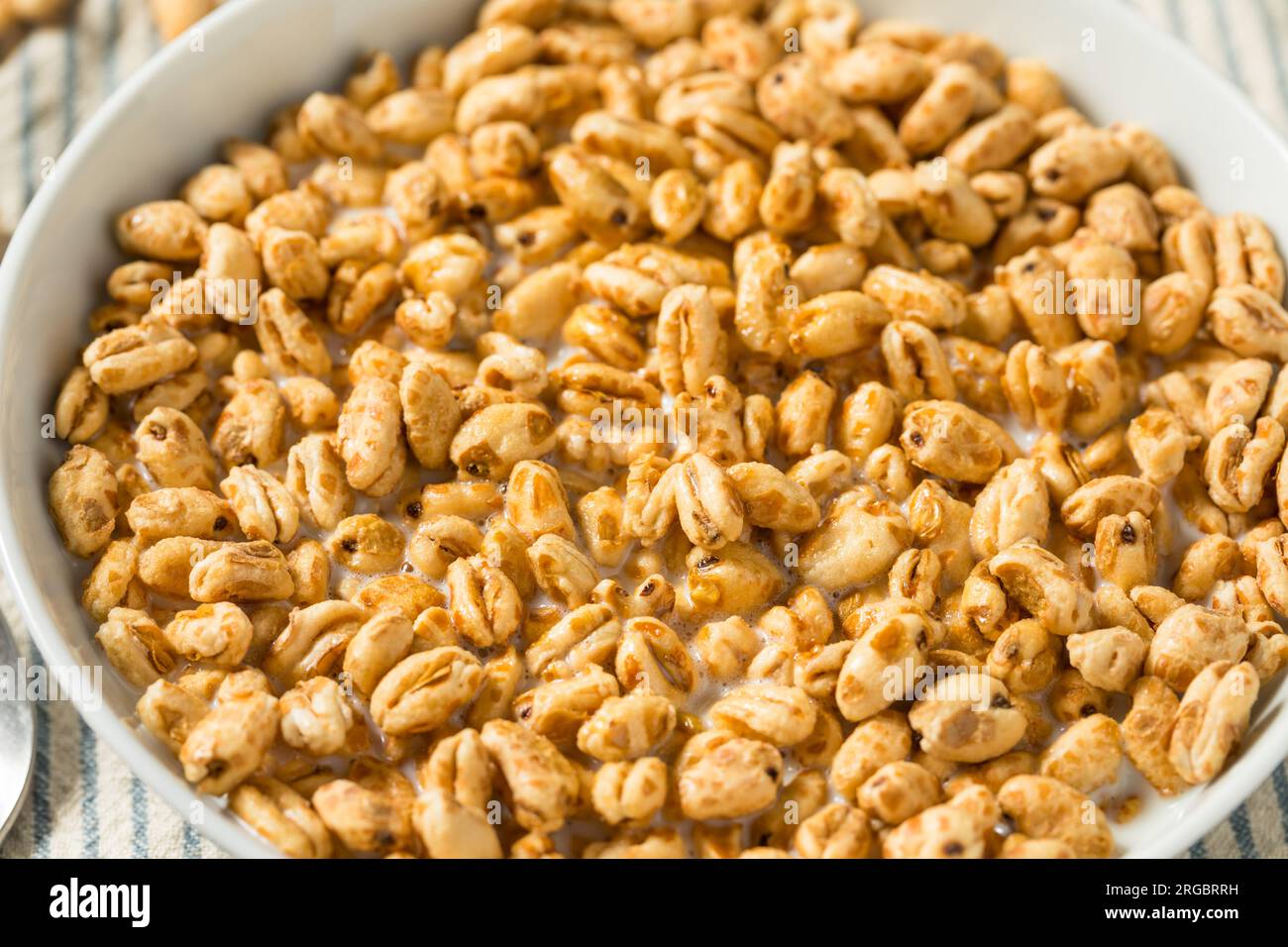 Healthy Sweet Puffed Wheat Breakfast Cereal and Whole Milk Stock Photo ...