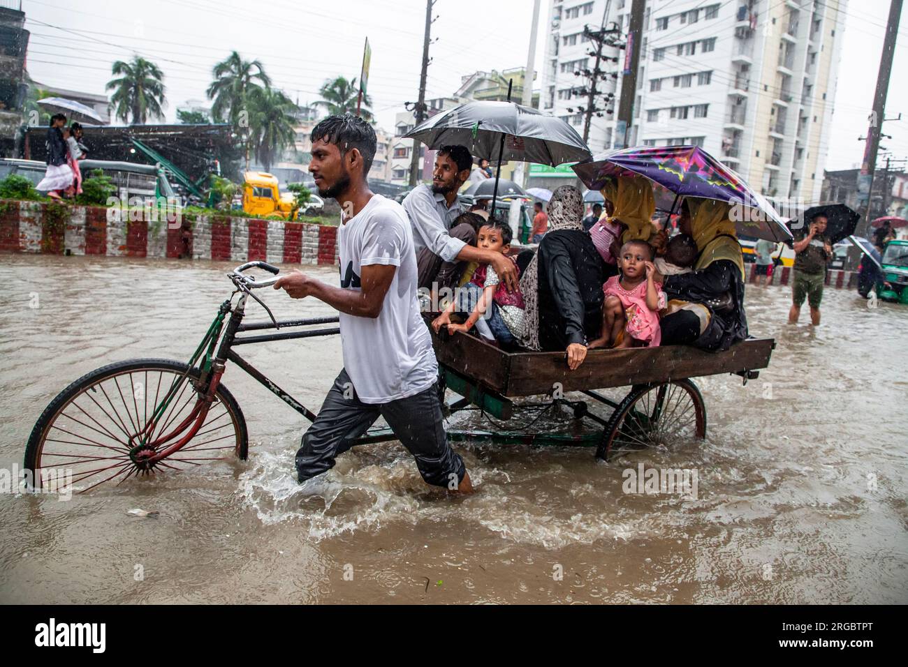 Rickshaws Vans Cars And Bicycles Push Through Waist Deep Water At
