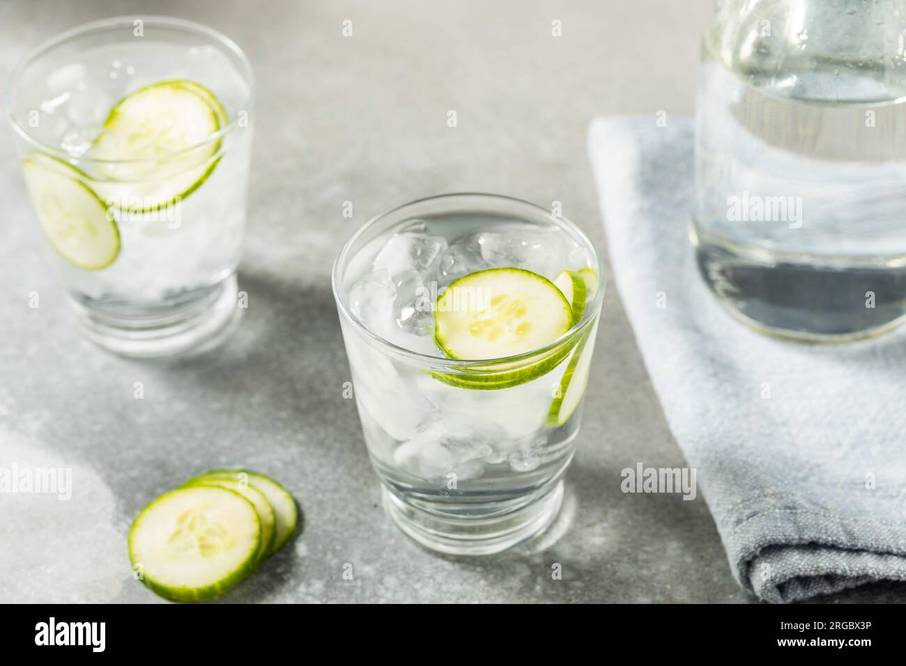 Cold Clear Refreshing Cucumber Water with Ice Stock Photo - Alamy