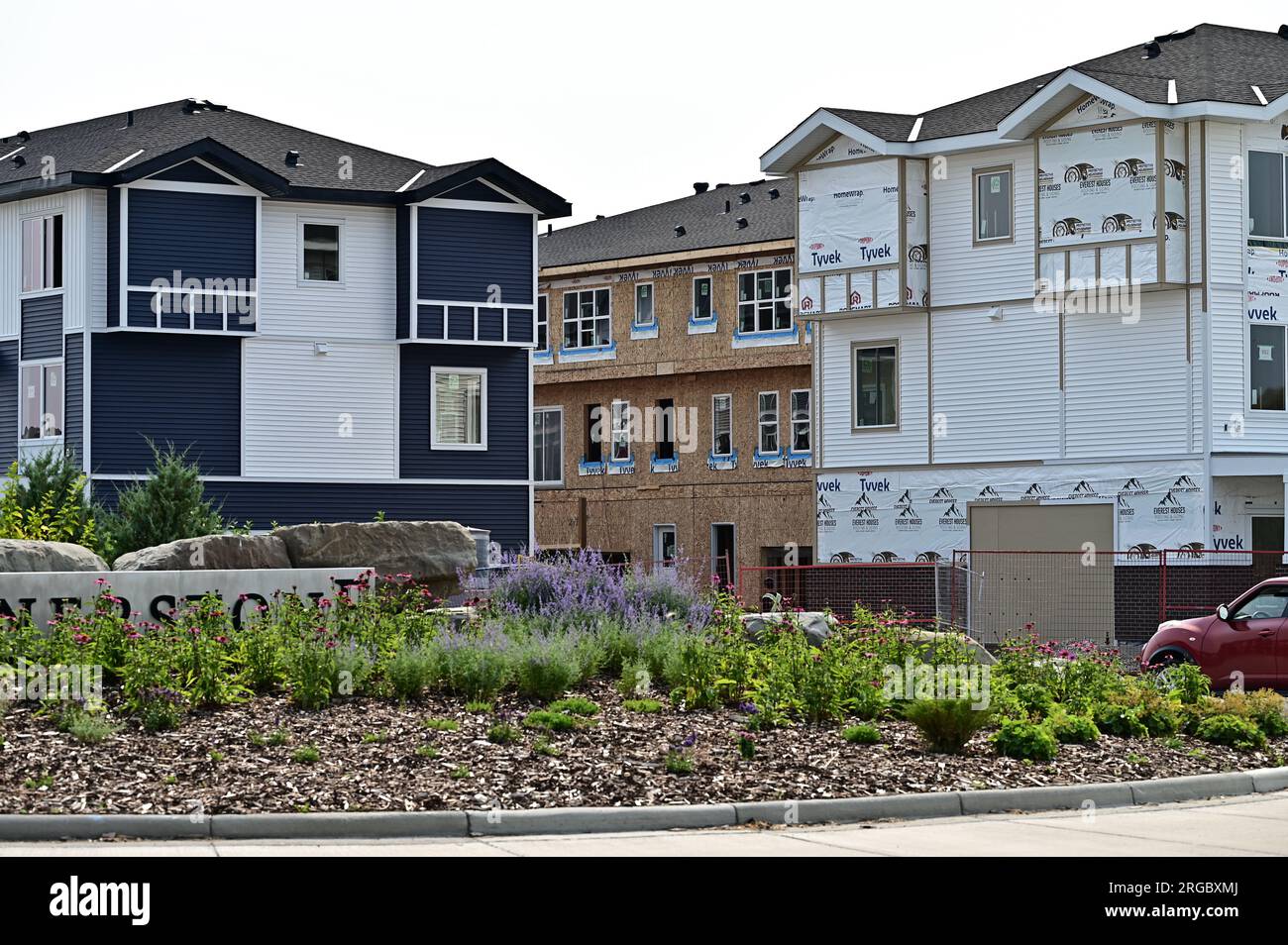 A new residential building standing next to similar but finished ...