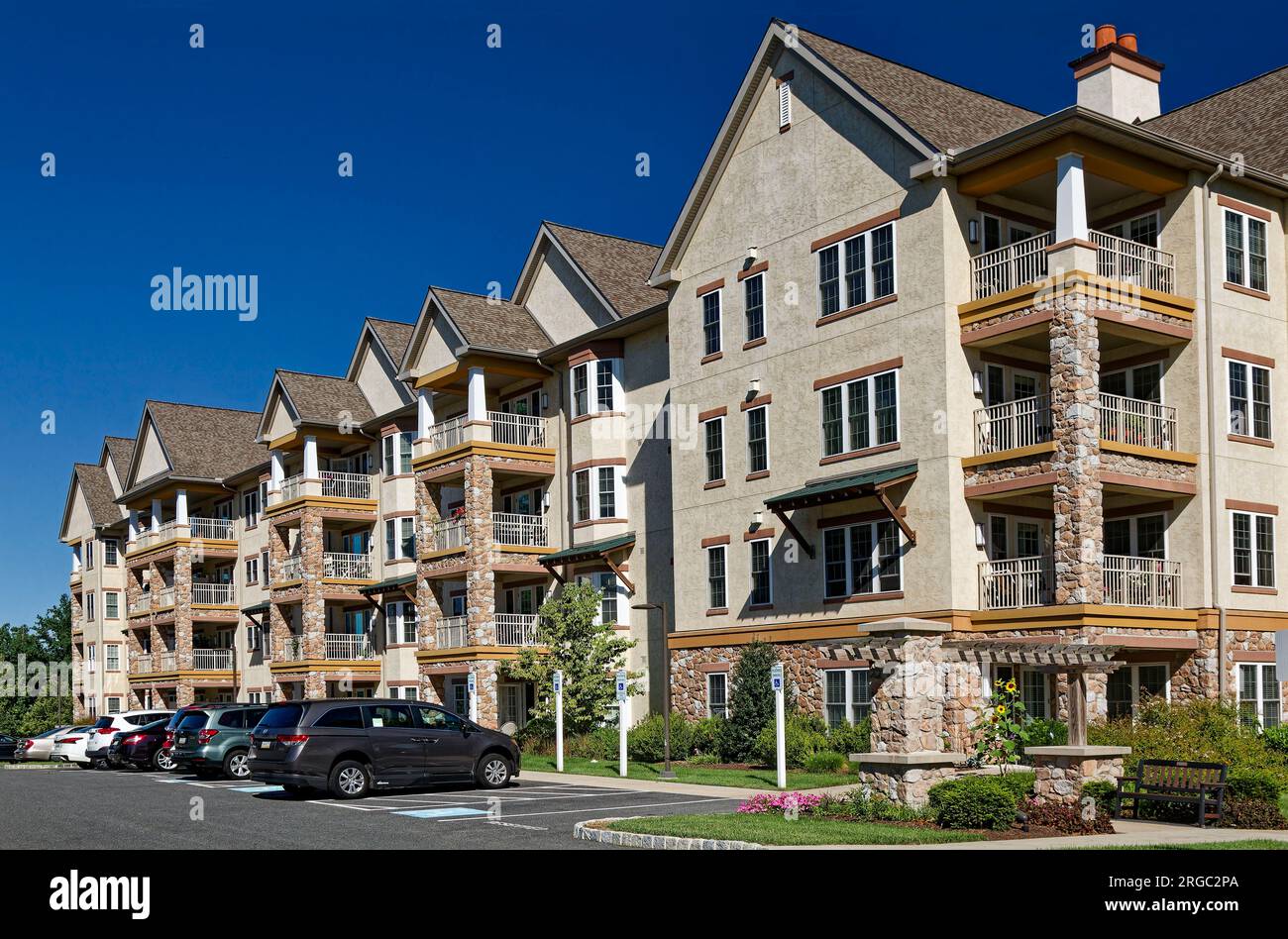 modern apartment building, 4 story, stone, stucco, balconies, cars ...