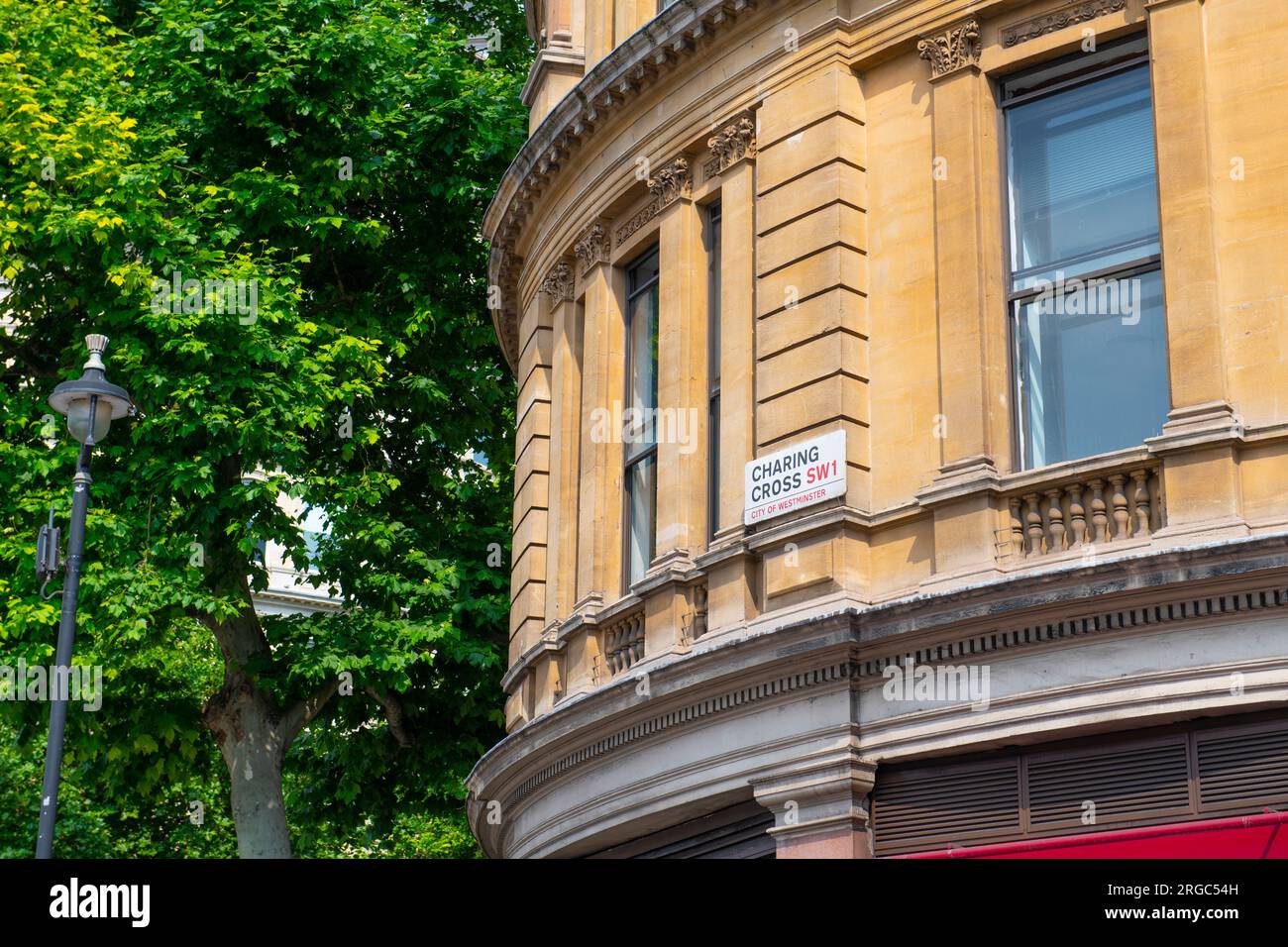Charing Cross road sign on historic building at Trafalgar Square in ...