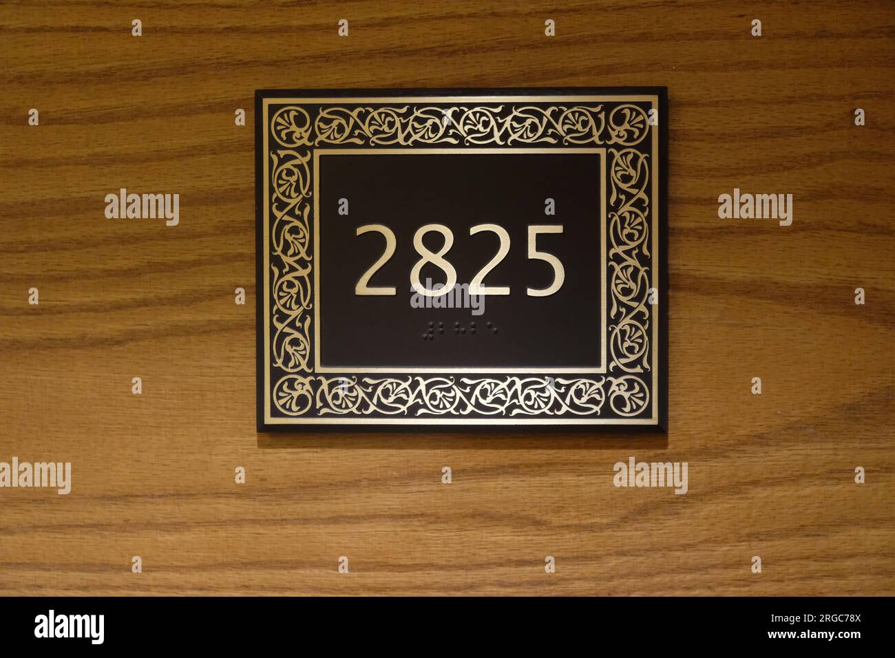 Room Number sign in Figures and Braille Stock Photo - Alamy