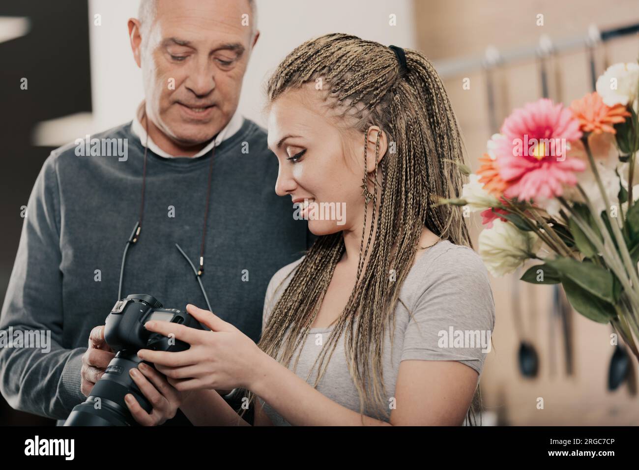 Expert young woman & mature man choose images for business ...