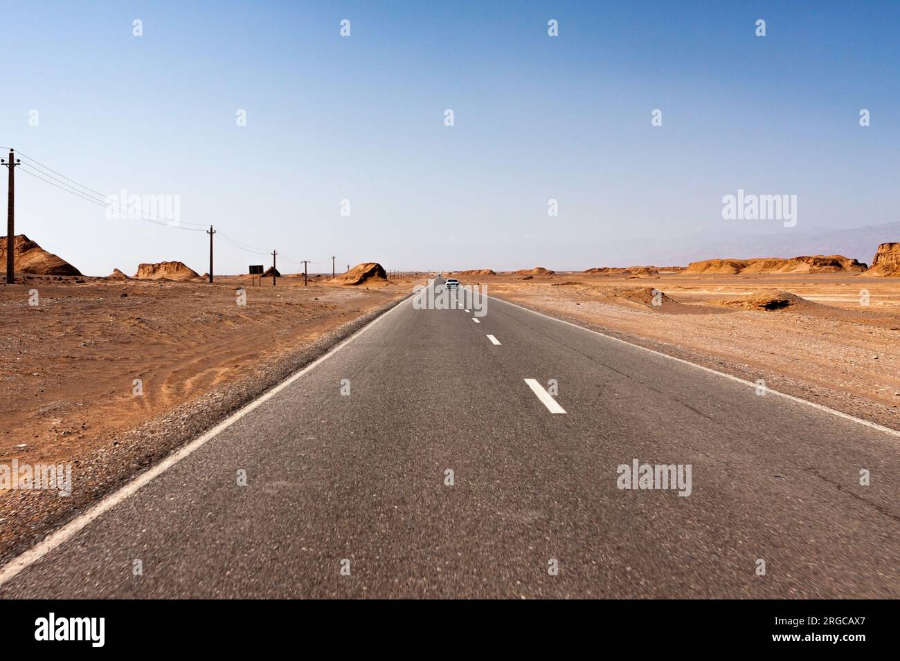 Road through desert. Highway in Lut Desert in Iran. Beautiful deserted ...