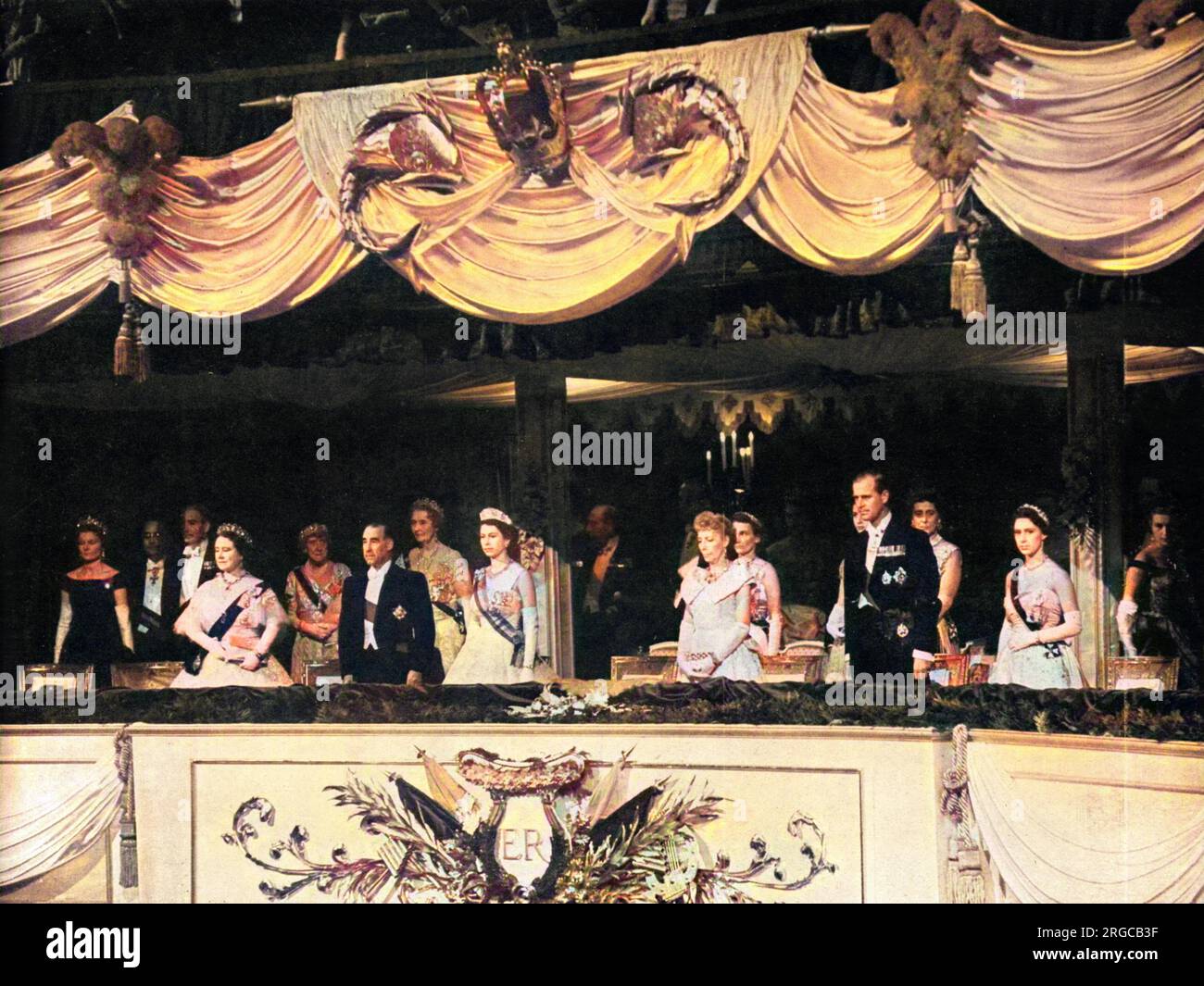 A gala opera performance at Covent Garden is attended by the Queen and ...