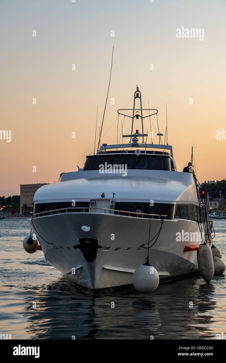 large luxury powerboat or motor cruiser at sunset Stock Photo - Alamy