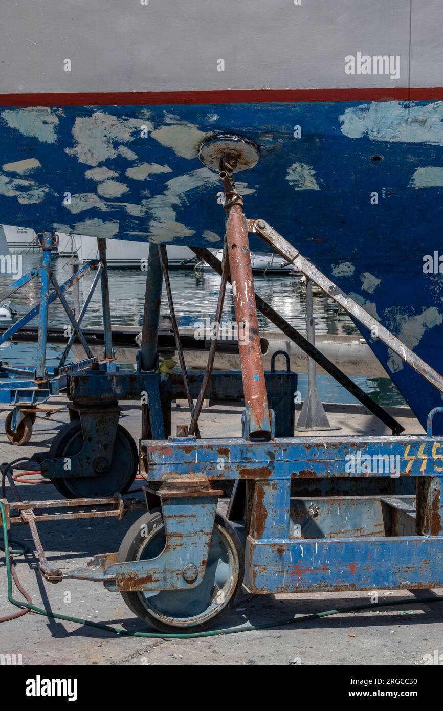 sailing yacht out of the water on the hard standing with props mounted ...
