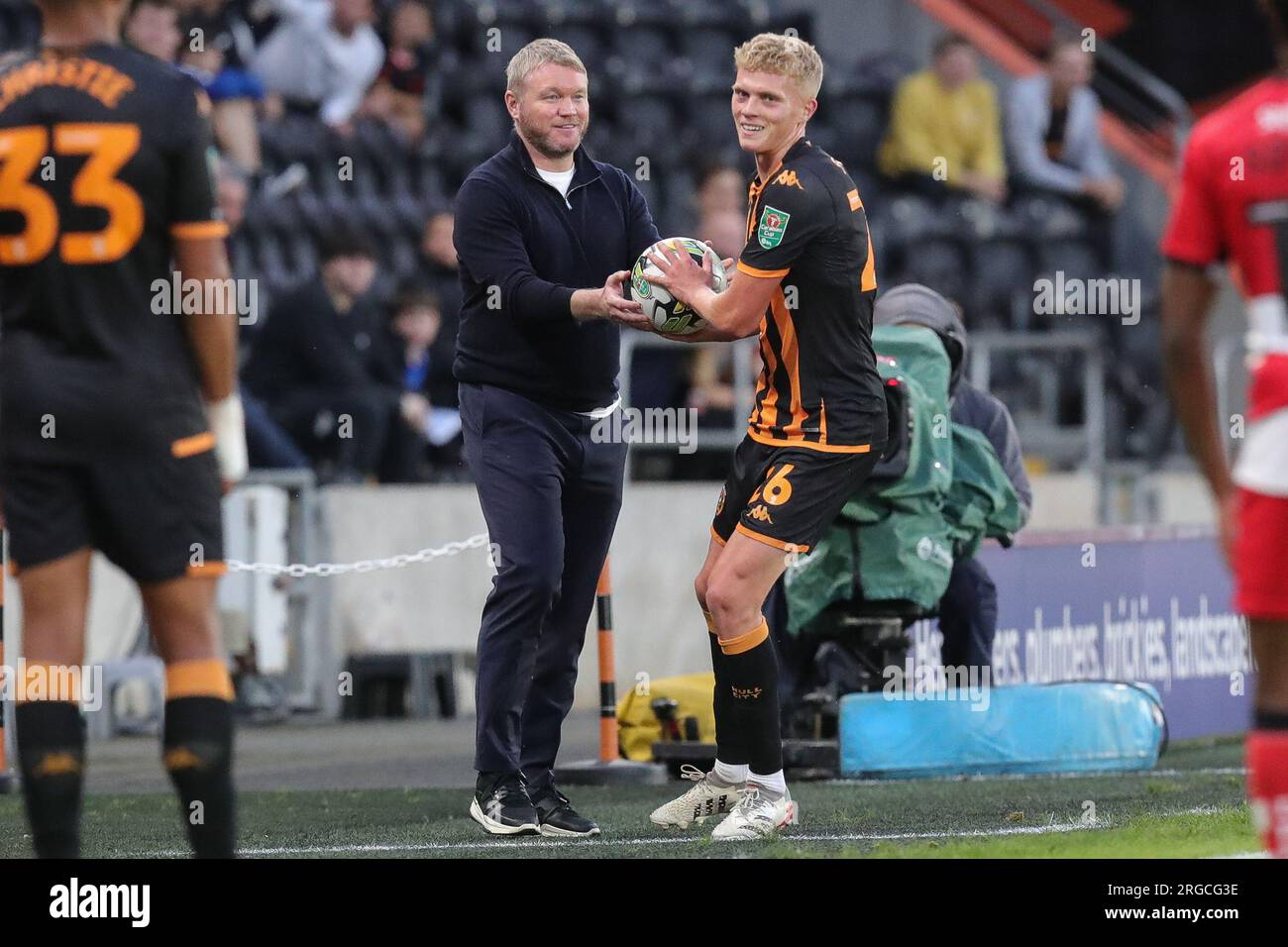 Grant McCann manager of Doncaster Rovers jokes with Andy Smith #26 of ...