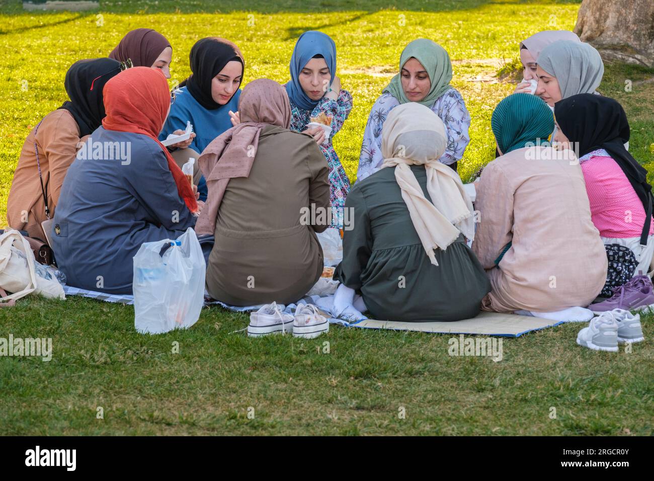 Istanbul, Turkey, Turkiye. Turkish Muslim Girls Relaxing on the Lawn of ...
