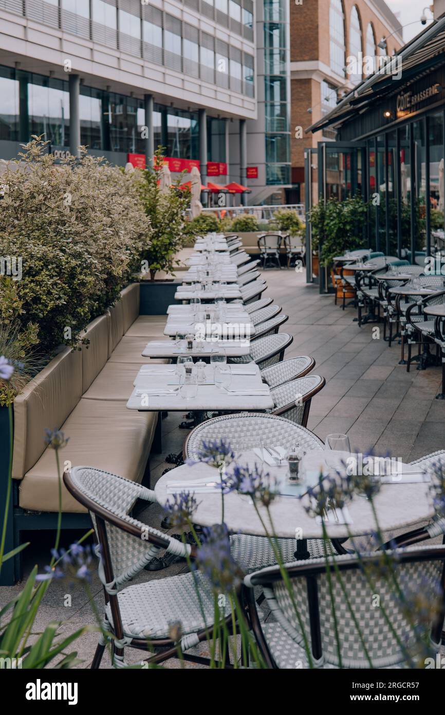 London, UK - July 06, 2023: Outdoor tables of Cote Brasserie restaurant ...