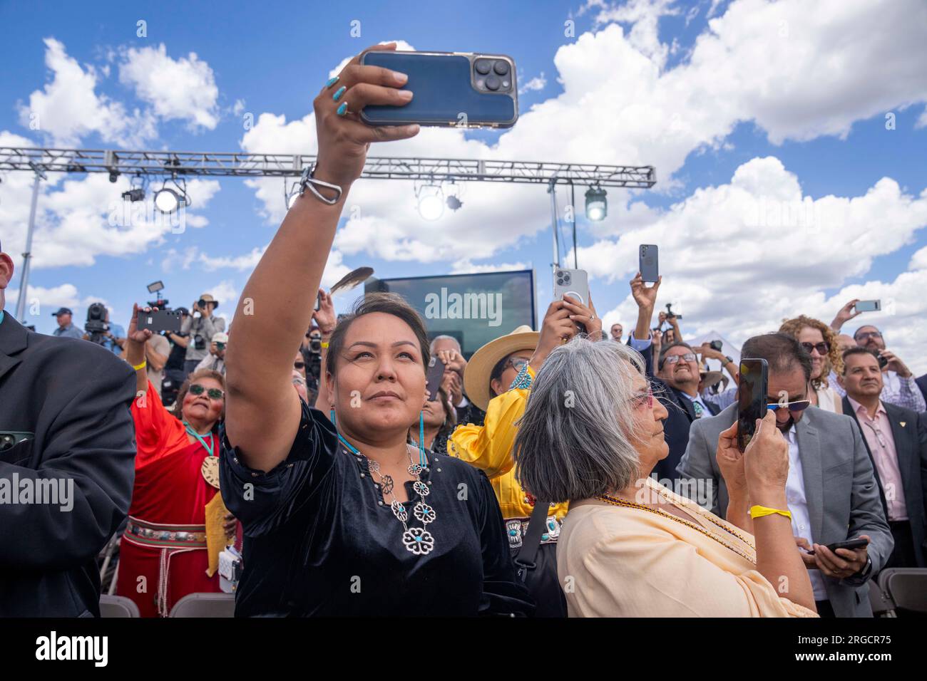 Supporters photograph as President Joe Biden signs a proclamation ...