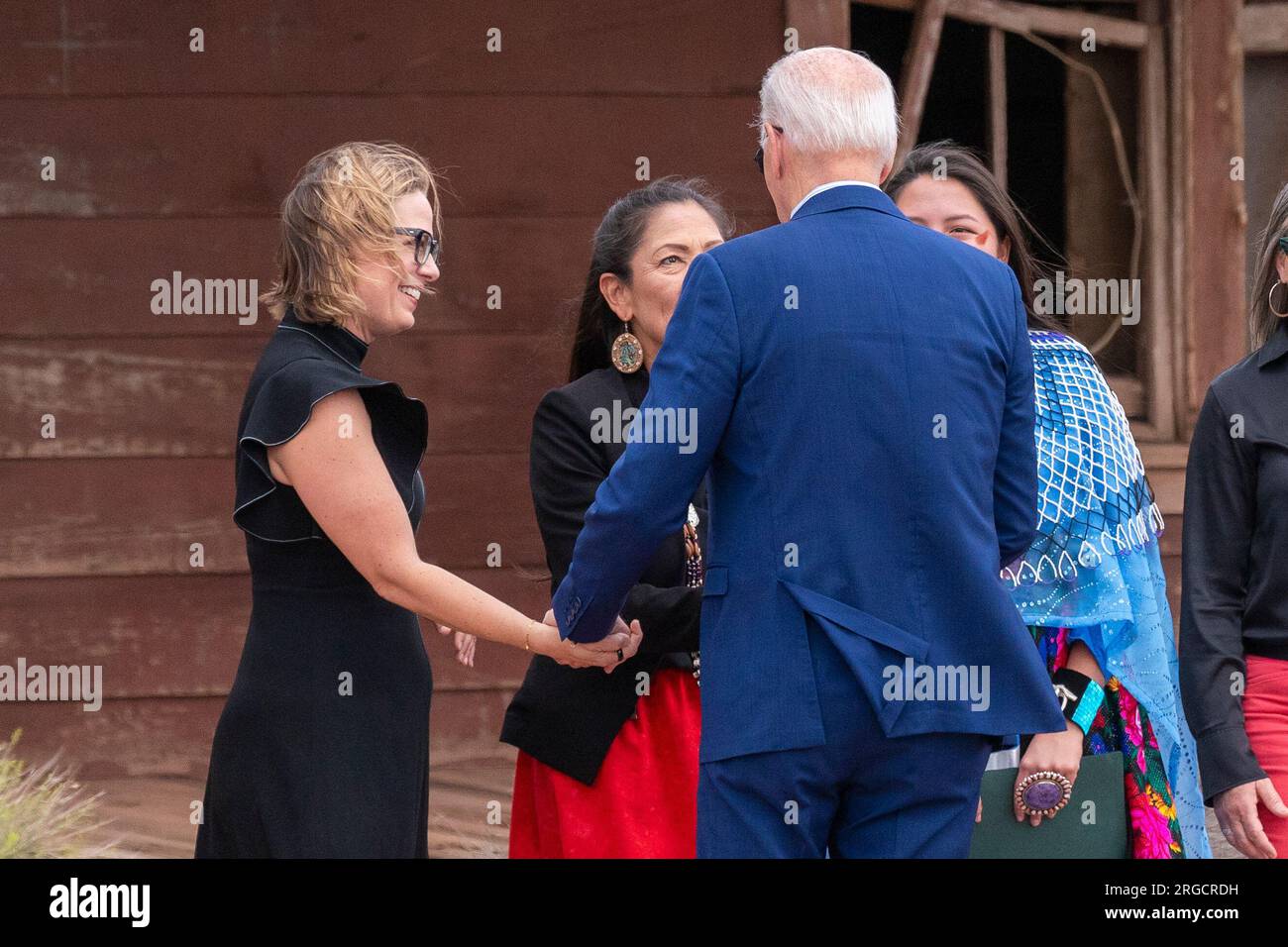 Sen. Kyrsten Sinema, I-Ariz., left, Interior Secretary Deb Haaland, and ...