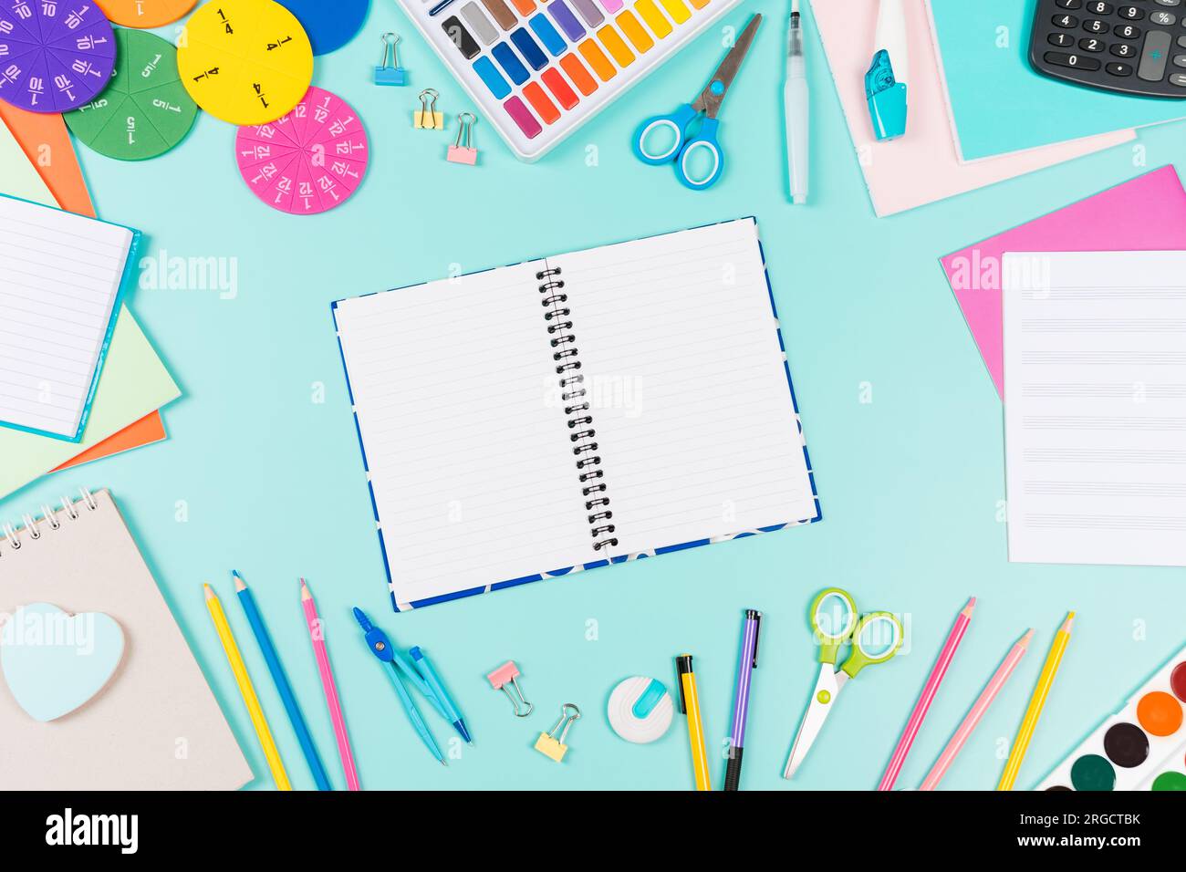 Back to school background. Colored pencils, books, notebooks, pens ...