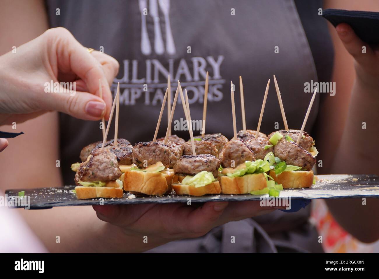 Small bites on a slate platter Stock Photo - Alamy