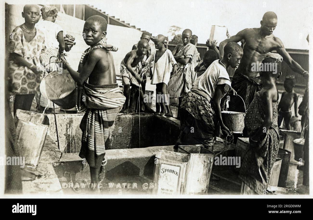 Ghana, West Africa - Drawing water for the day from the well Stock ...