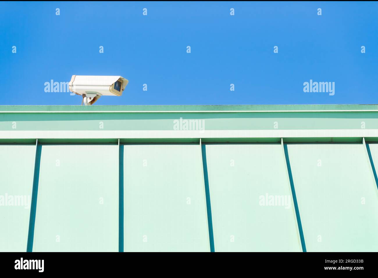 Security Camera on Left Side of Green Roof in Bright Sunlight Stock ...