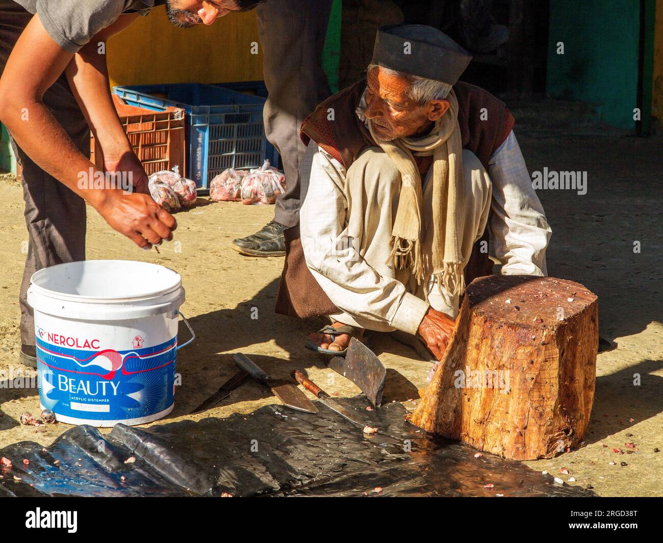 Indian butcher cutting and selling meat on the streets at Lamgara ...