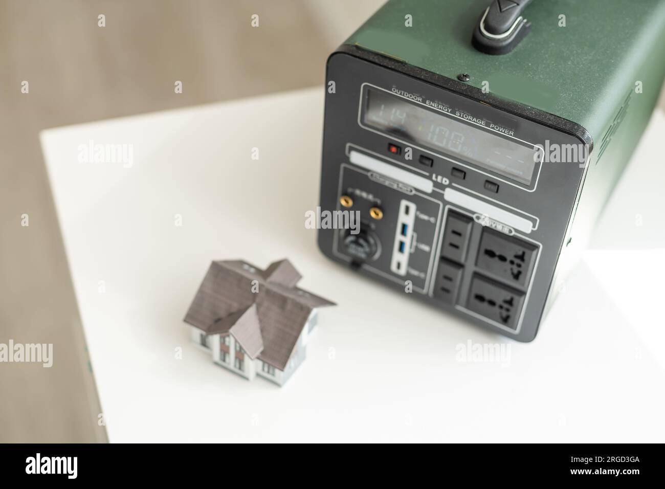 Portable power station charging devices on floor in living room Stock ...