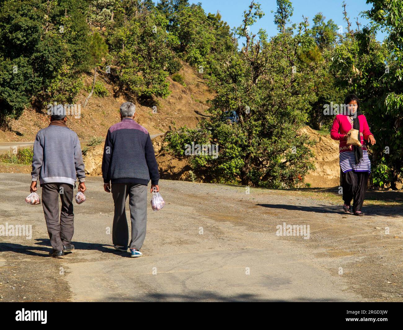 Indian people walking on the road at Lamgara Village, Kumaon Hills ...
