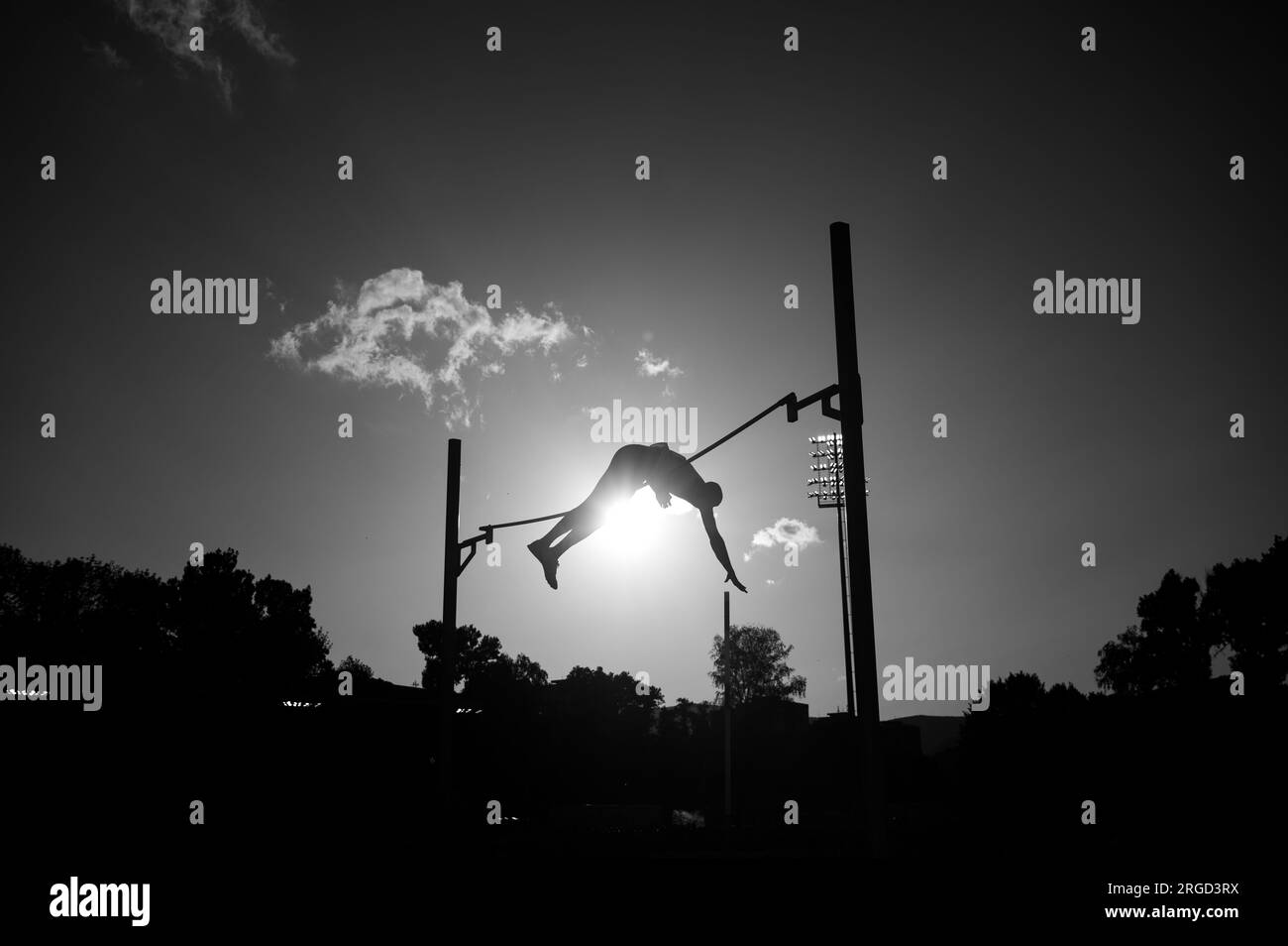 Pole vault silhouette. Professional athlete jumping at the stadium ...