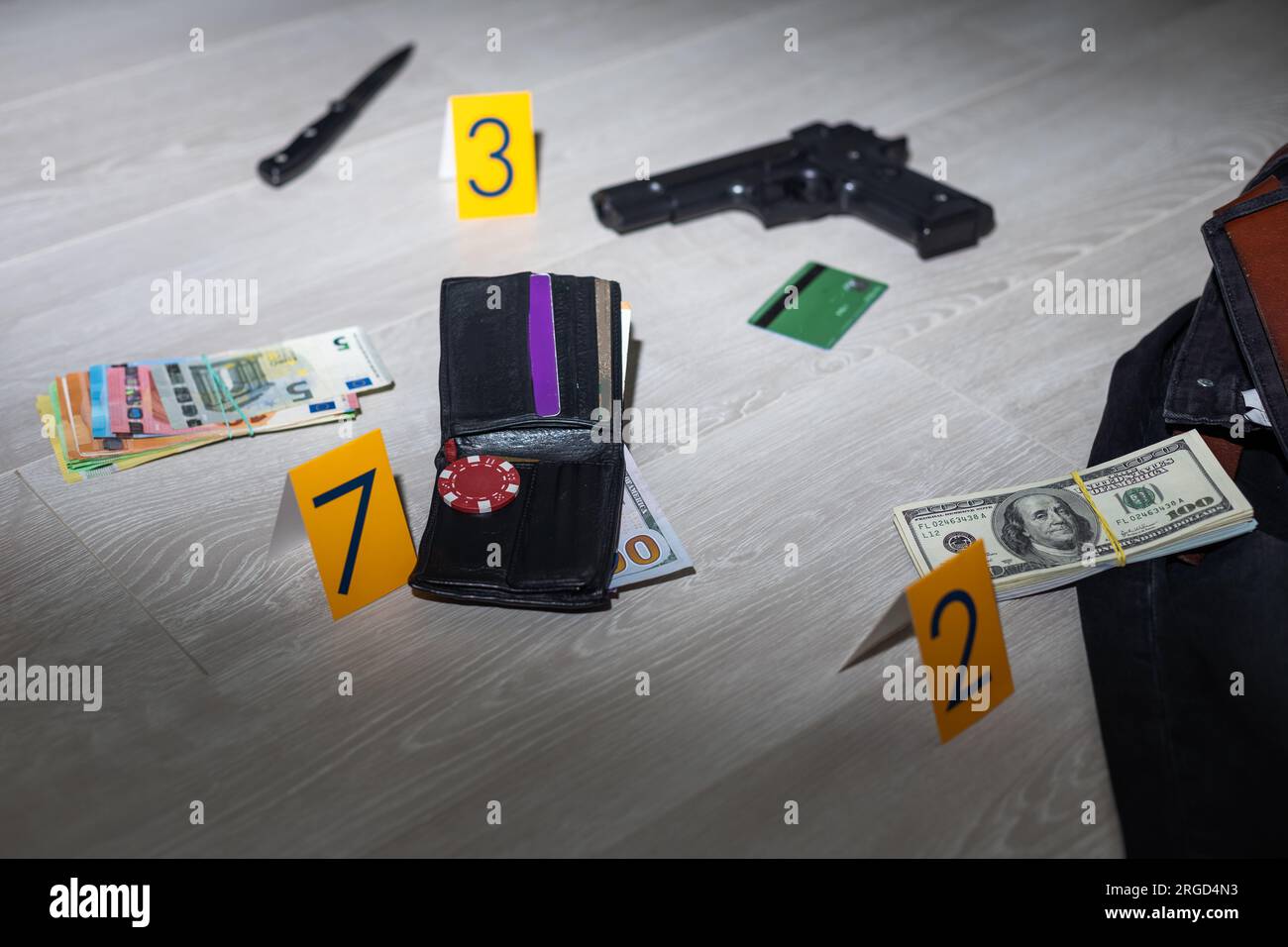 Flat lay composition with evidences and crime scene markers on wooden ...
