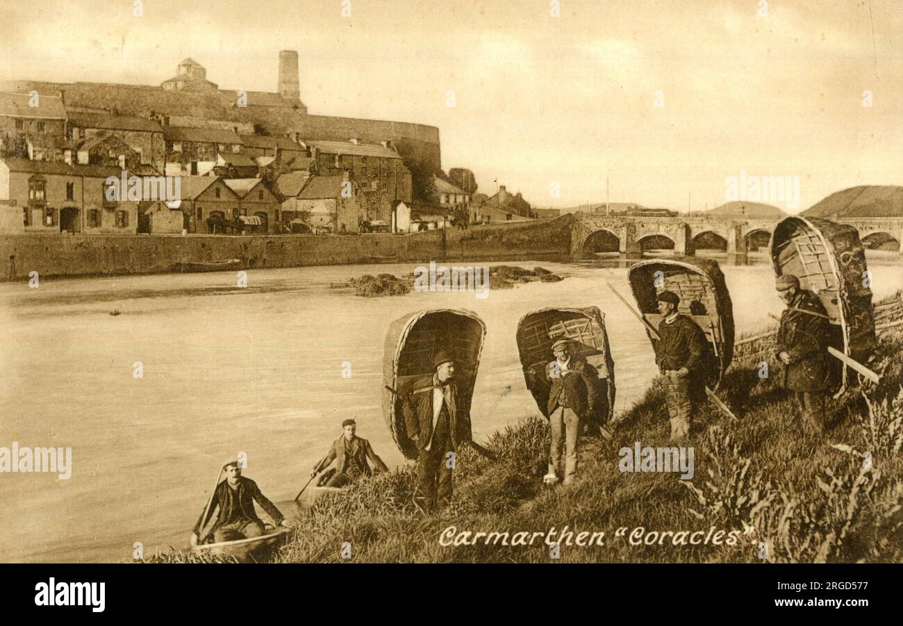 Welshmen carrying coracle boats, Carmarthen Stock Photo - Alamy