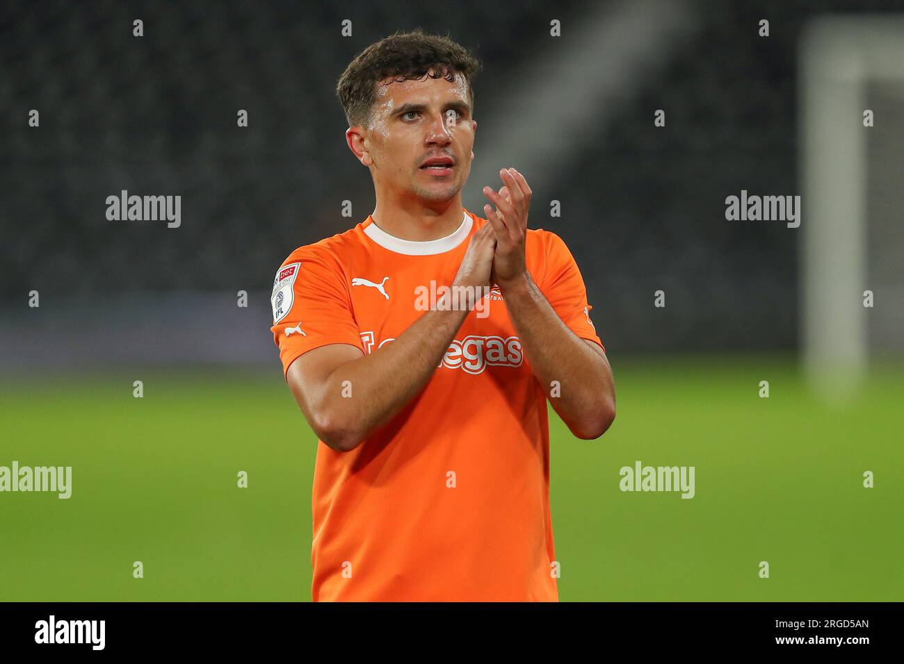 Albie Morgan #8 of Blackpool applauds the travelling fans after the ...
